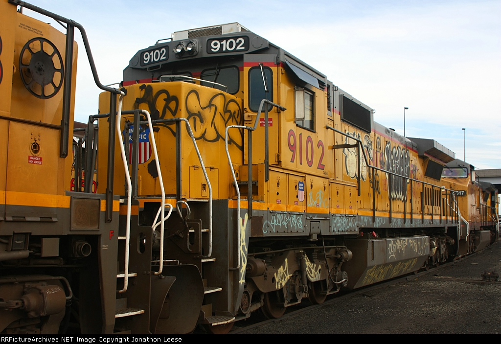 Badly graffited UP 9102